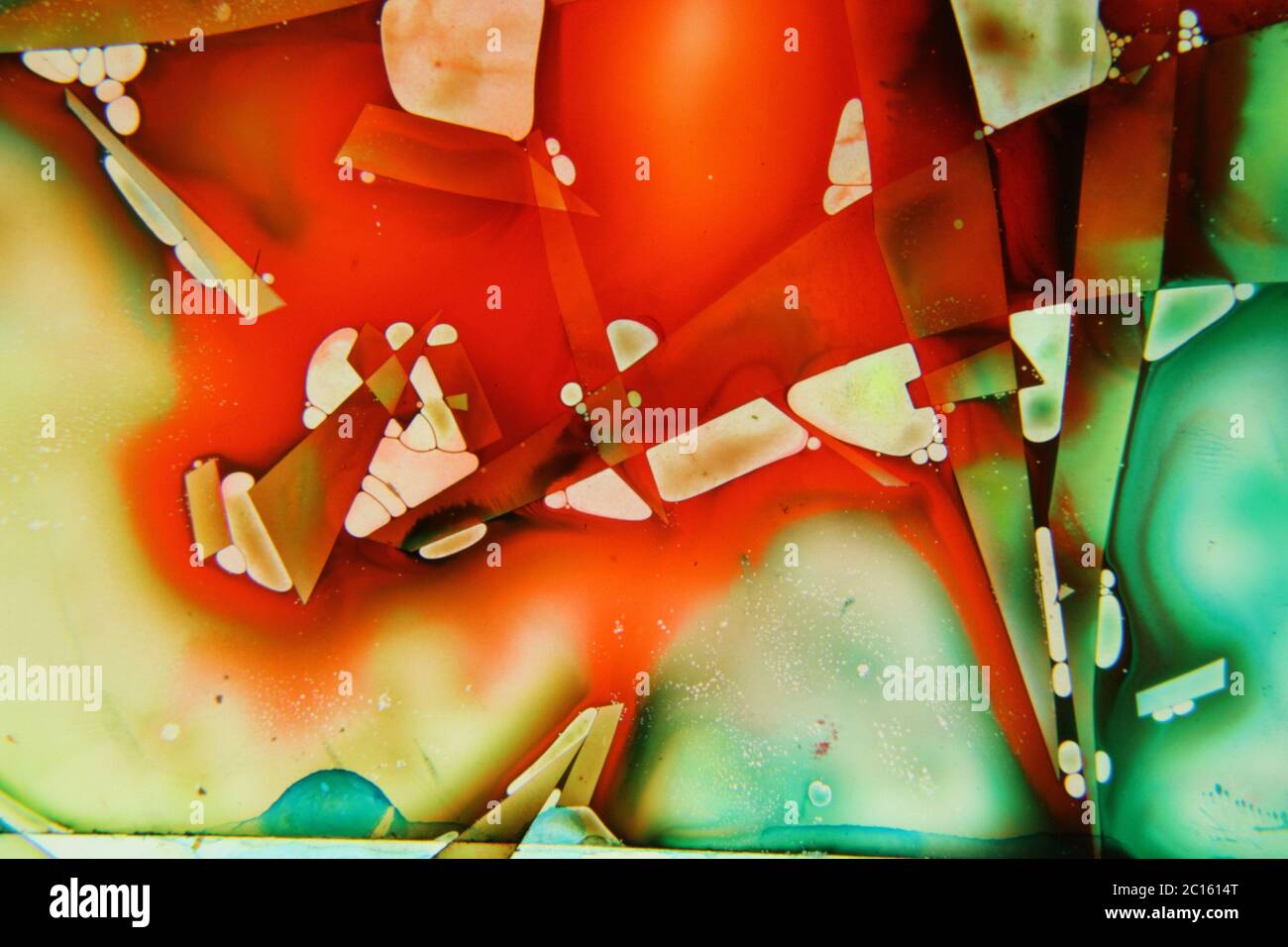 Colored liquids mixed together in fluid creating colorful abstract ...