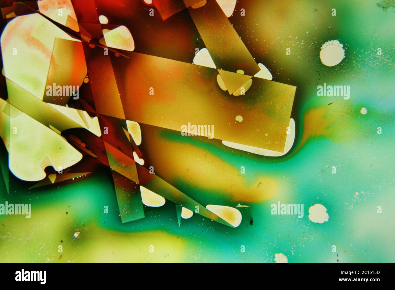 Colored liquids mixed together in fluid creating colorful abstract ...