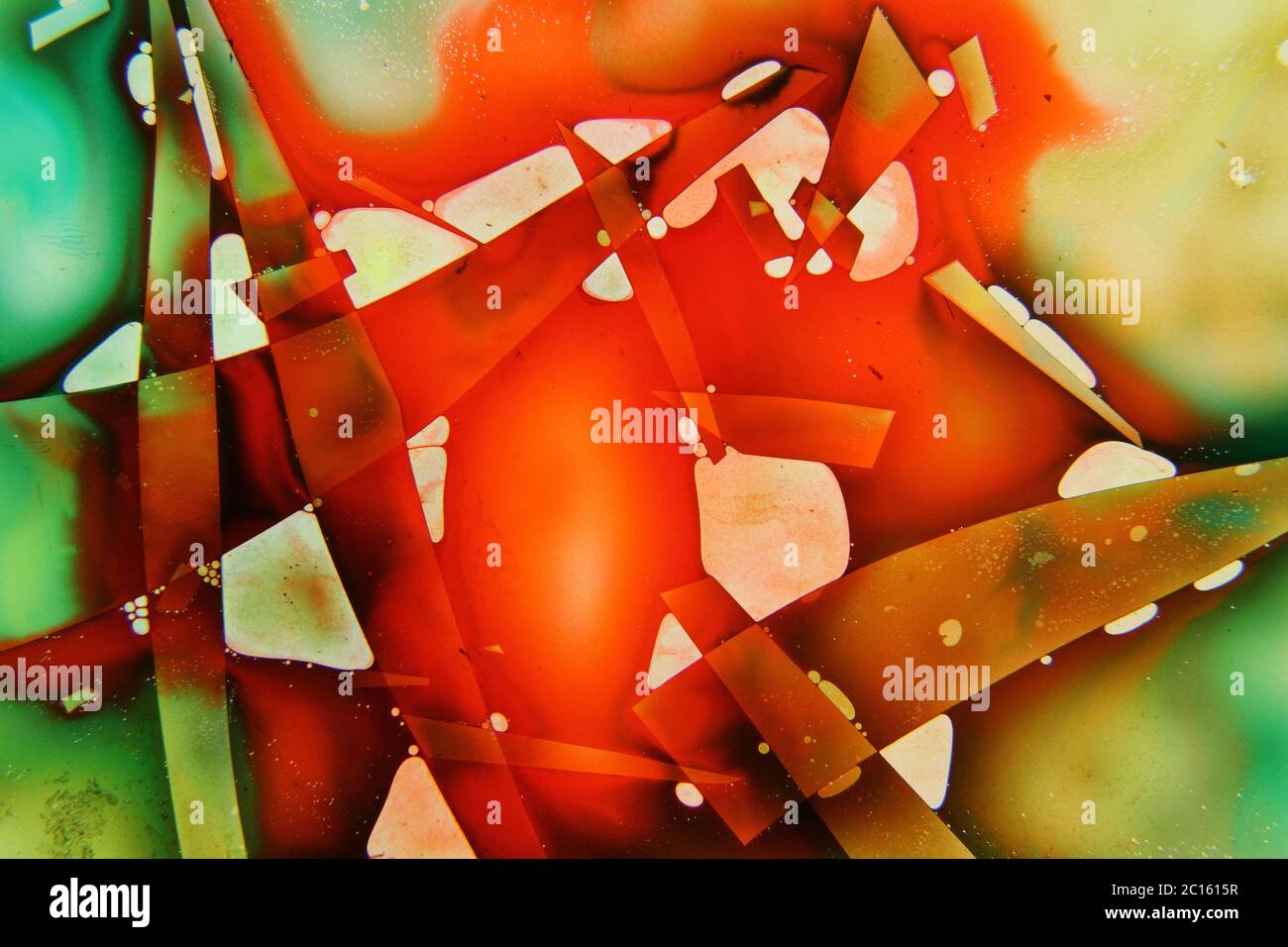 Colored liquids mixed together in fluid creating colorful abstract ...