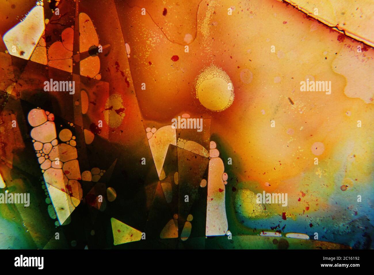 Colored liquids mixed together in fluid creating colorful abstract ...
