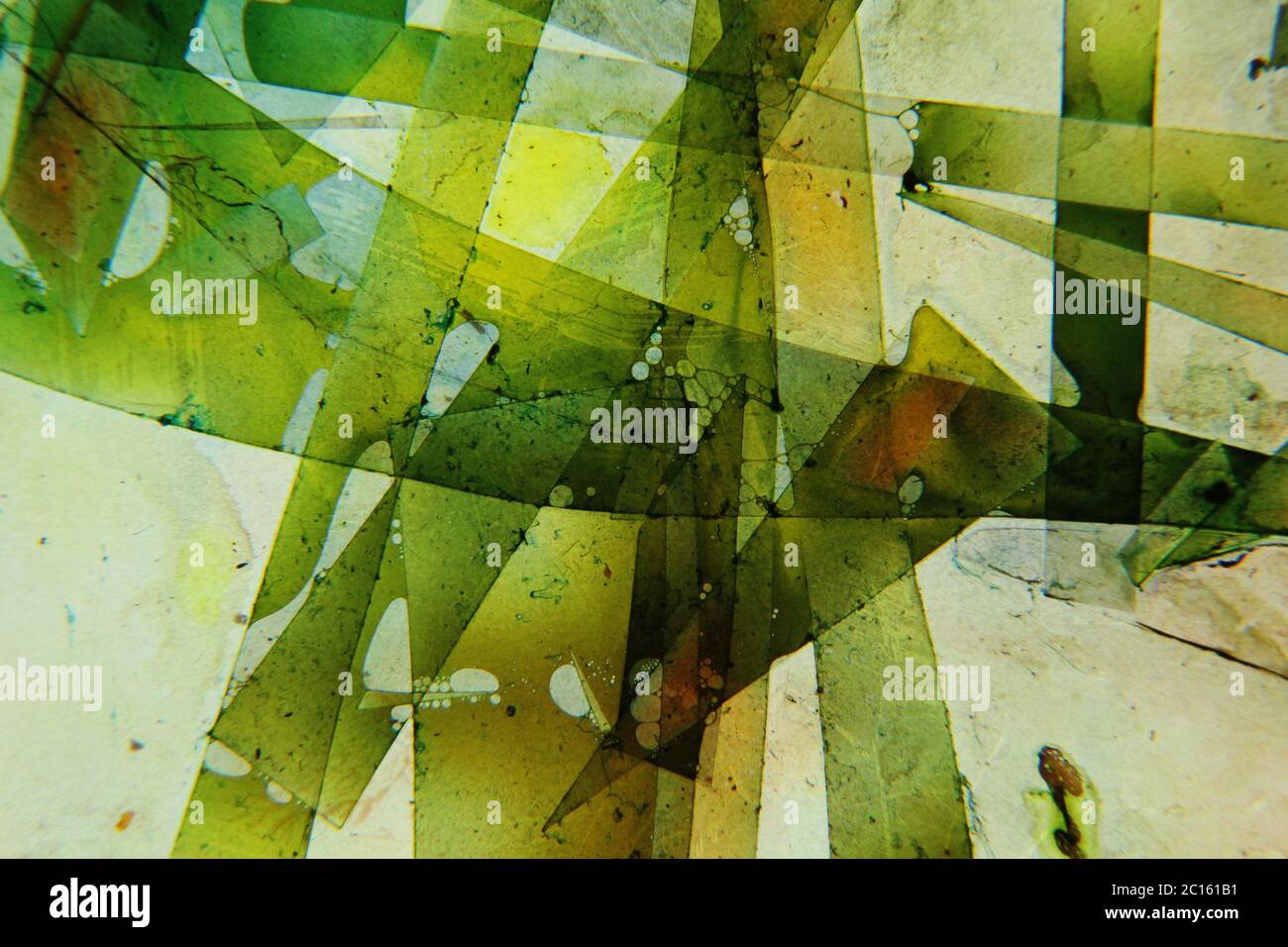 Colored liquids mixed together in fluid creating colorful abstract ...