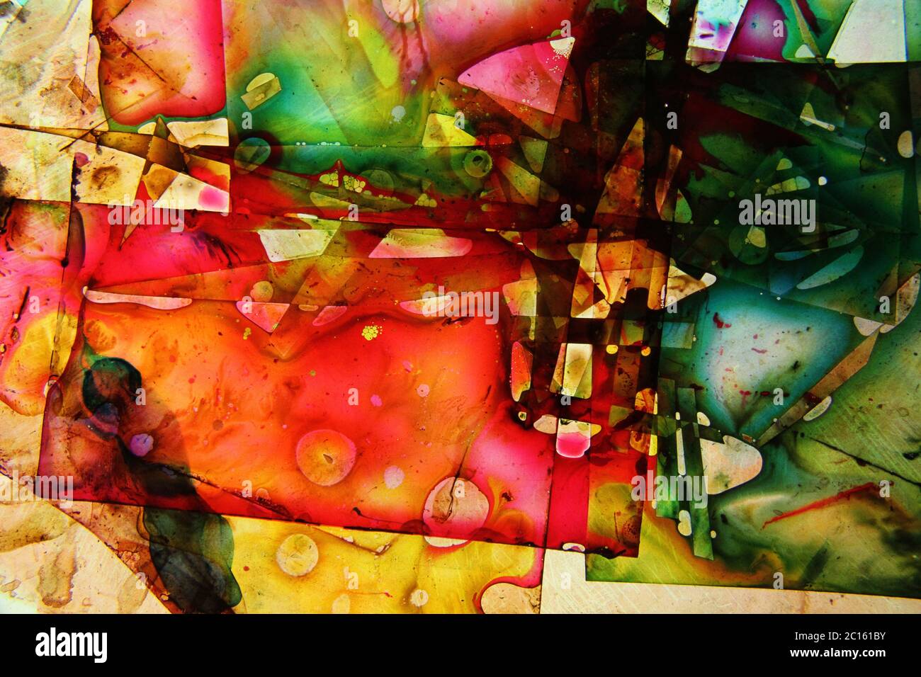 Colored liquids mixed together in fluid creating colorful abstract ...