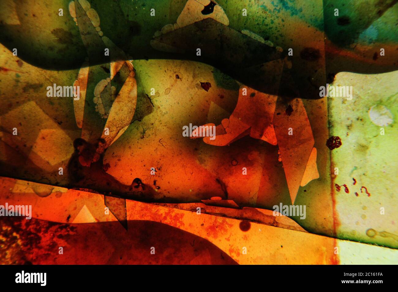Colored liquids mixed together in fluid creating colorful abstract ...