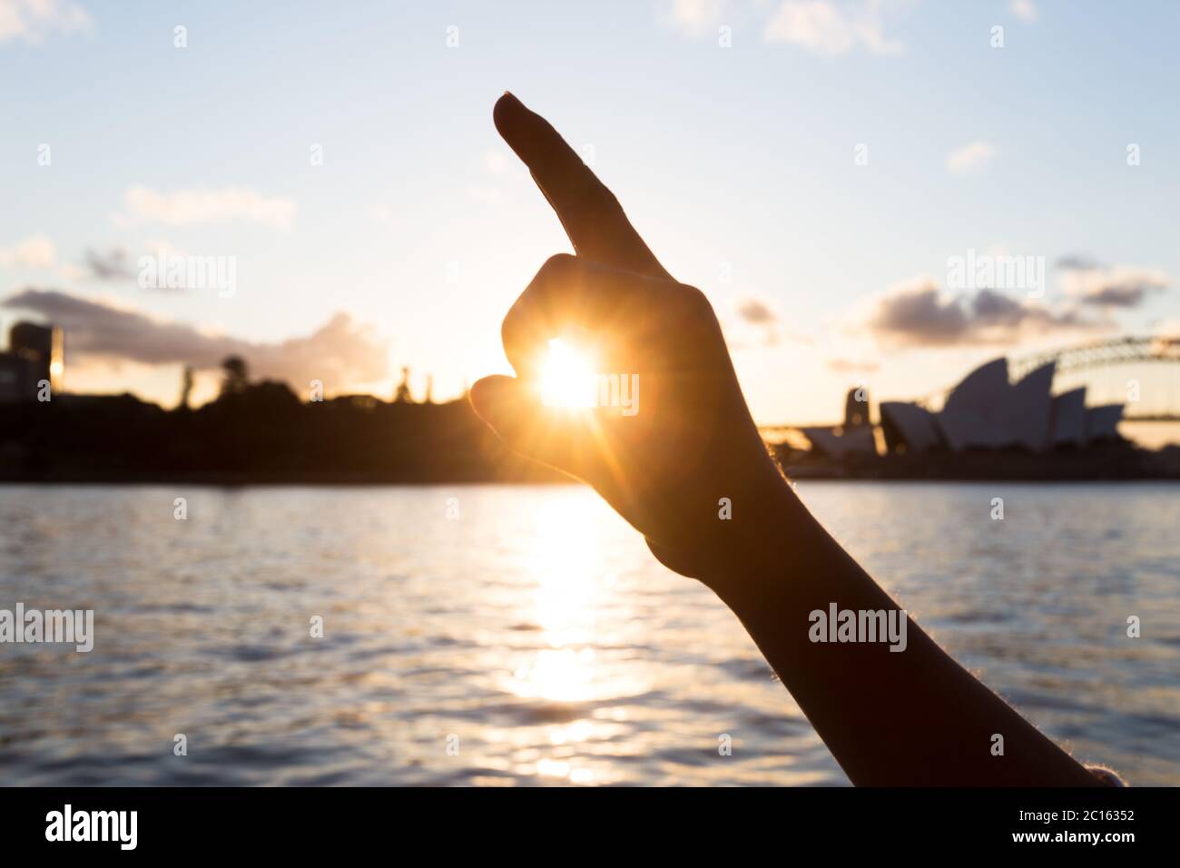 hand with sun with sydney opera house and bridge Stock Photo - Alamy