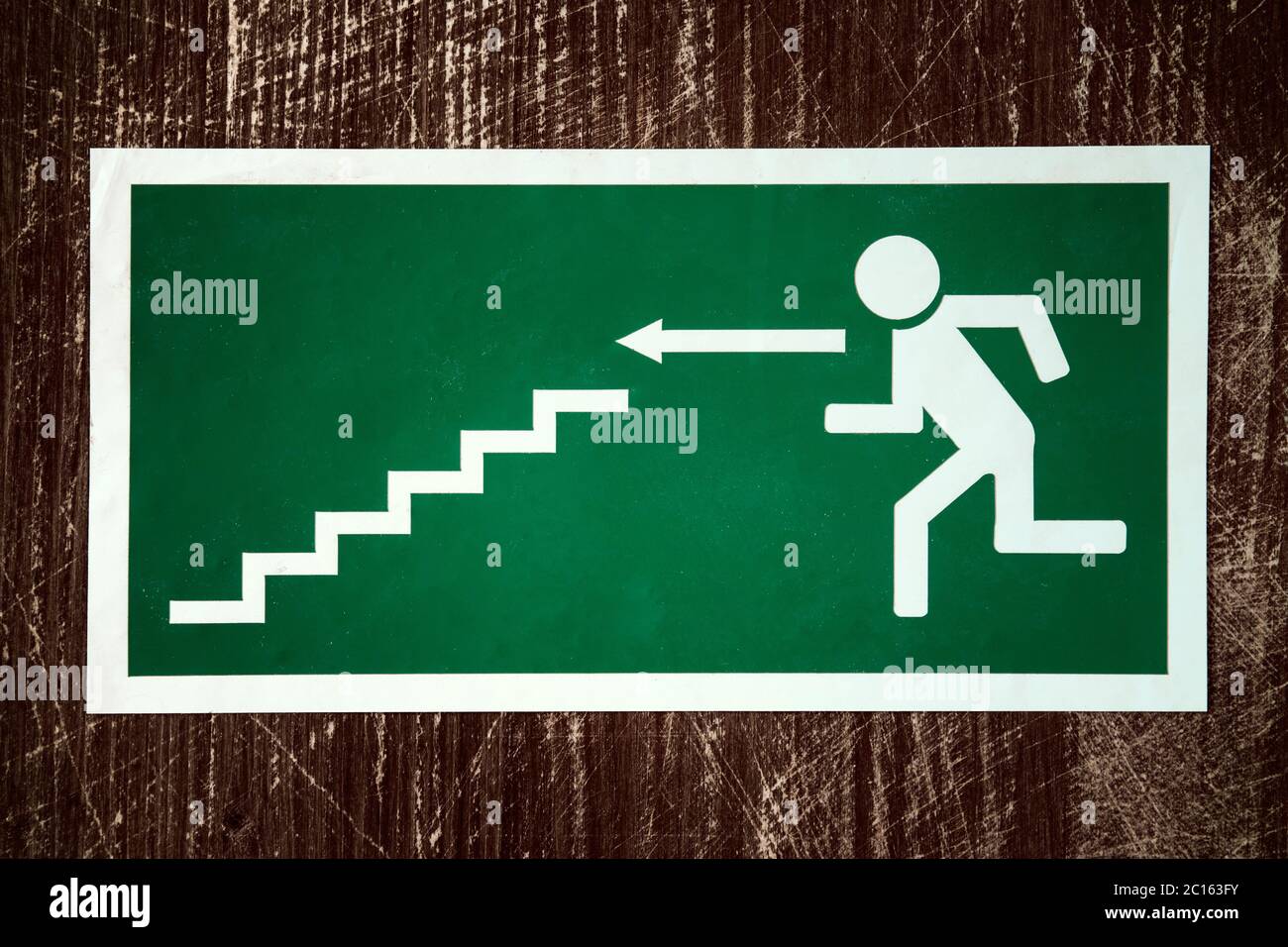 Green emergency fire exit sign Stock Photo - Alamy