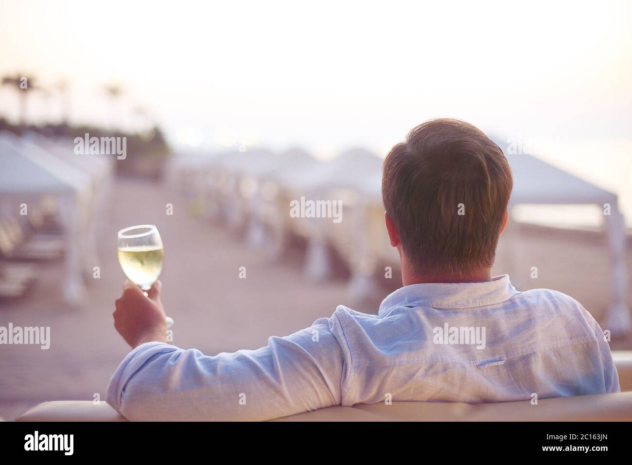 Relaxing man on the beach Stock Photo - Alamy