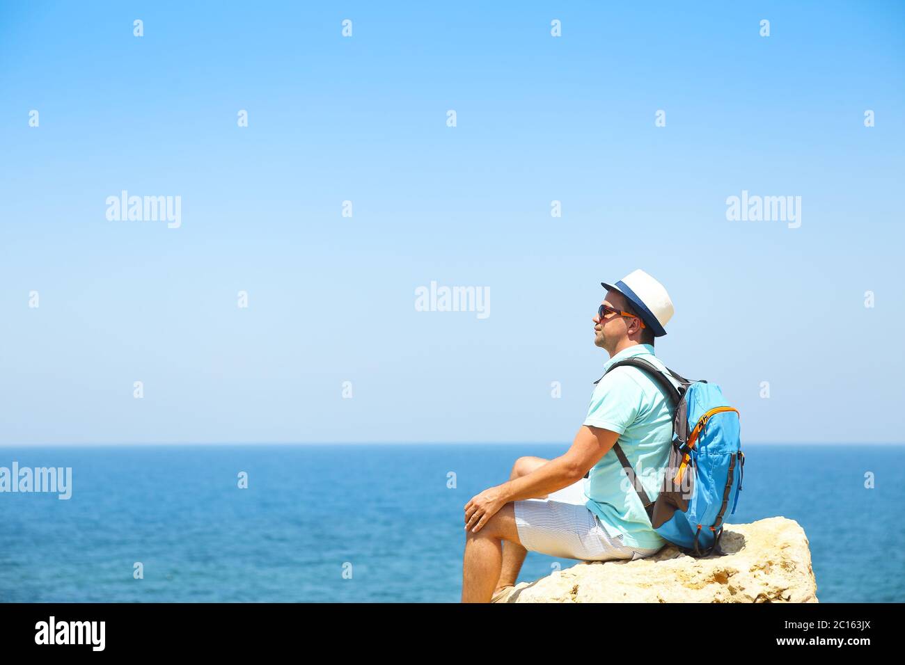 Man rock sea lonely hi-res stock photography and images - Alamy