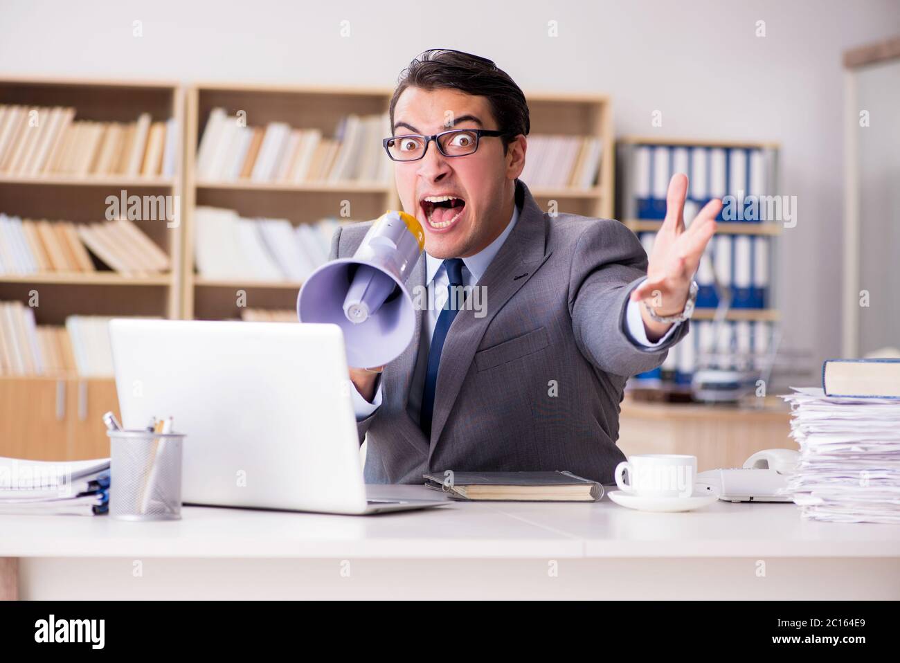Angry businessman working in the office Stock Photo - Alamy