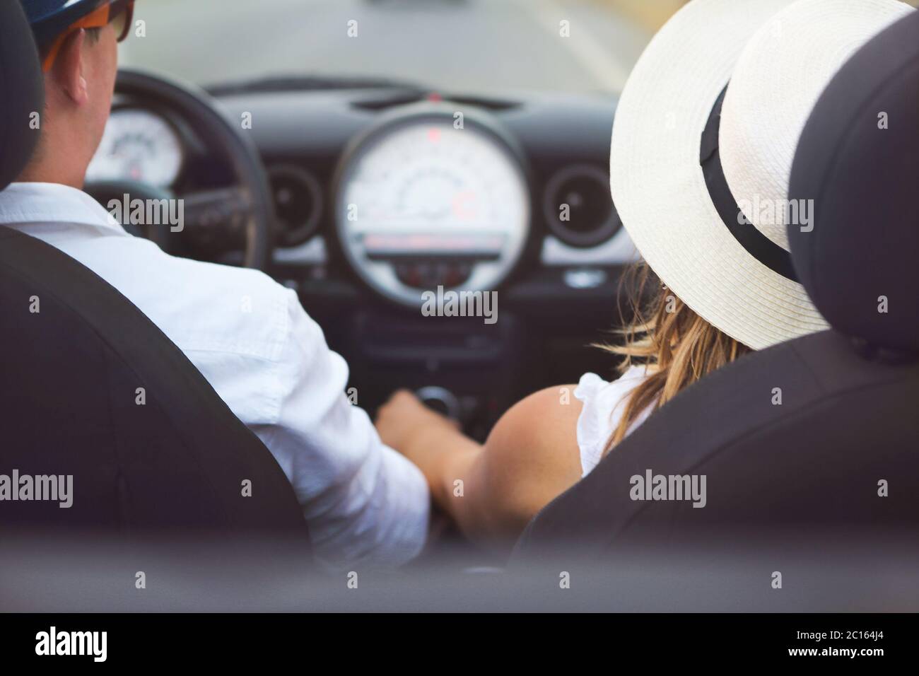Happy Couple Driving on Country Road in Car Stock Photo - Alamy