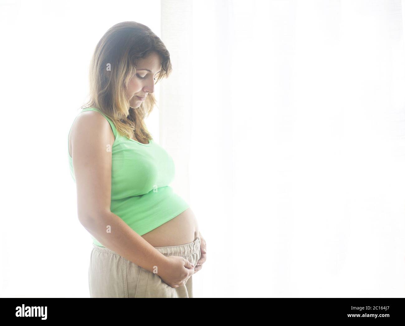 Pregnant woman big belly belly Cut Out Stock Images & Pictures - Alamy
