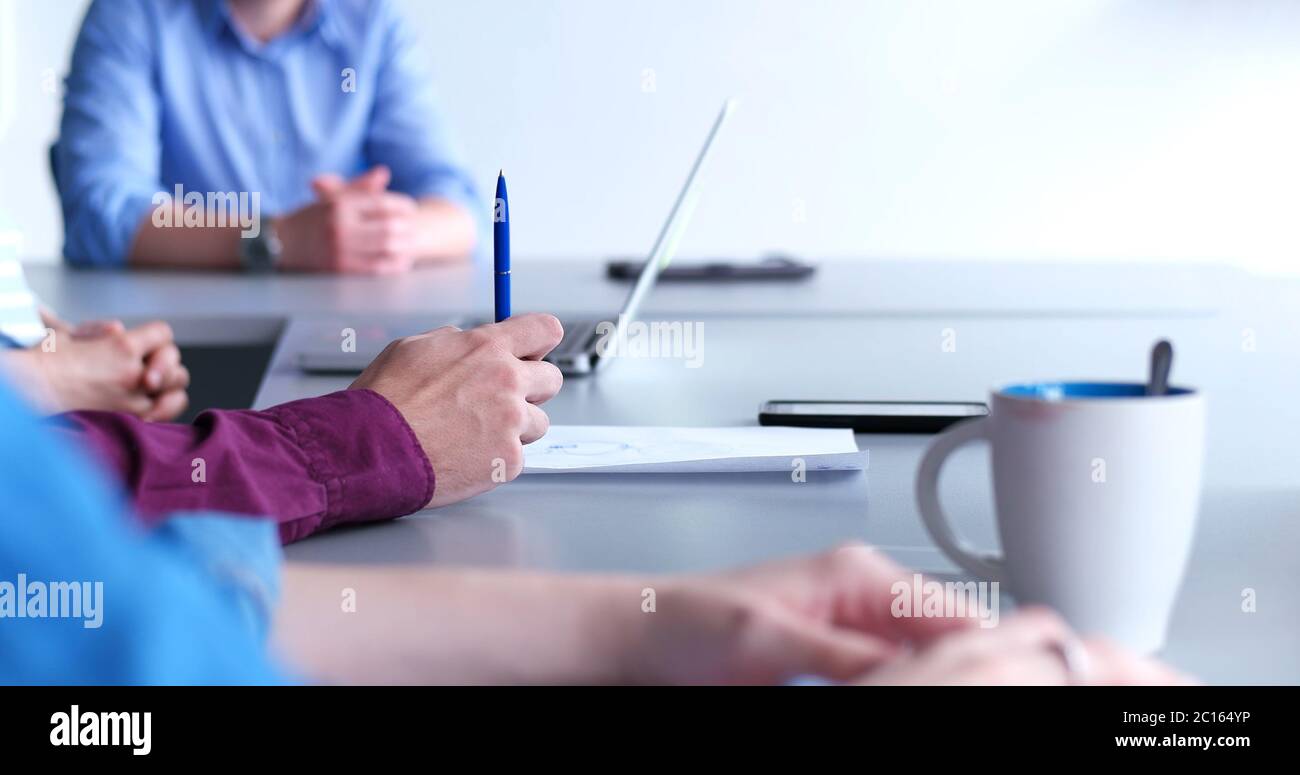 office and teamwork concept - group of business people having a meeting ...