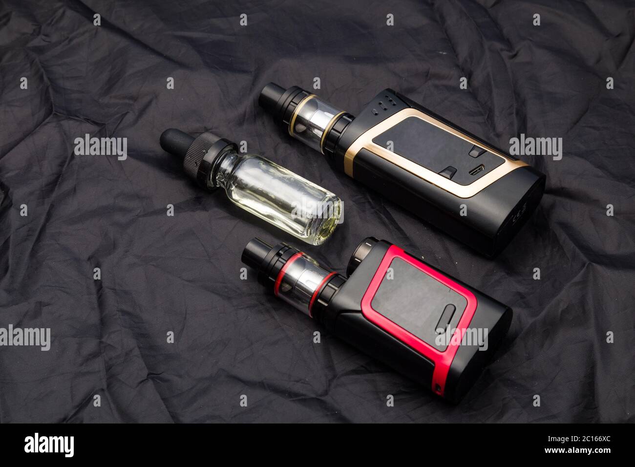 Vaping electronic mech mod and vape liquid Stock Photo - Alamy