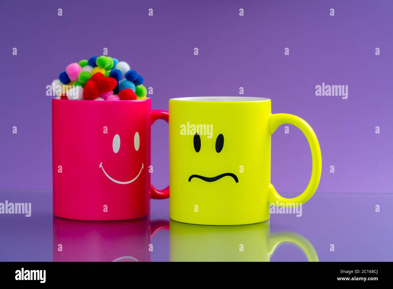 Two mugs with happy and sad emotions on the background. Concept, Coffee ...