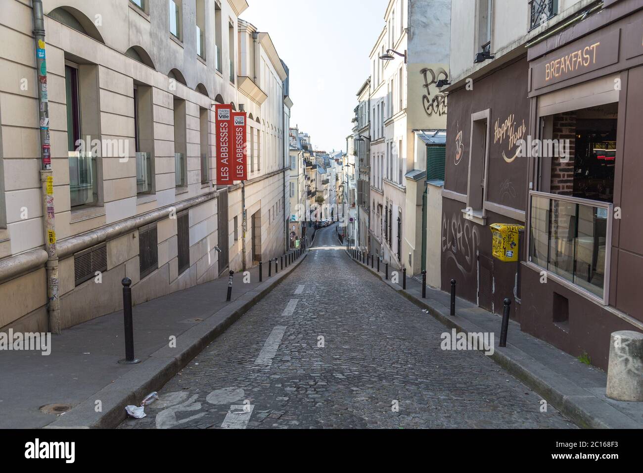 Paris, France, March 26, 2017: View on narrow cobbled street among ...
