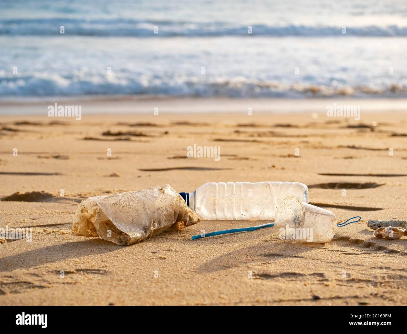 plastic garbage on sand sea beach Stock Photo - Alamy