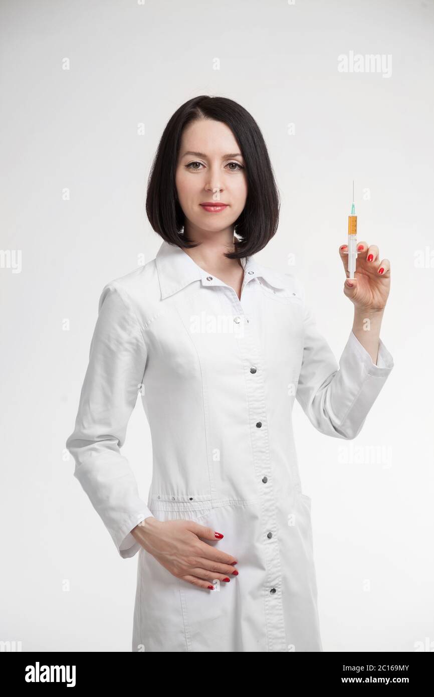 the beautiful woman the doctor with the syringe Stock Photo - Alamy