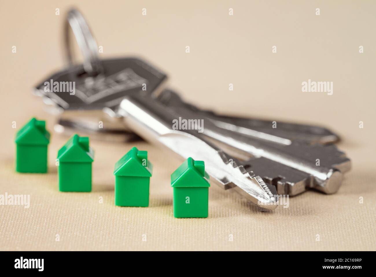 Green miniature houses and bunch of keys Stock Photo - Alamy