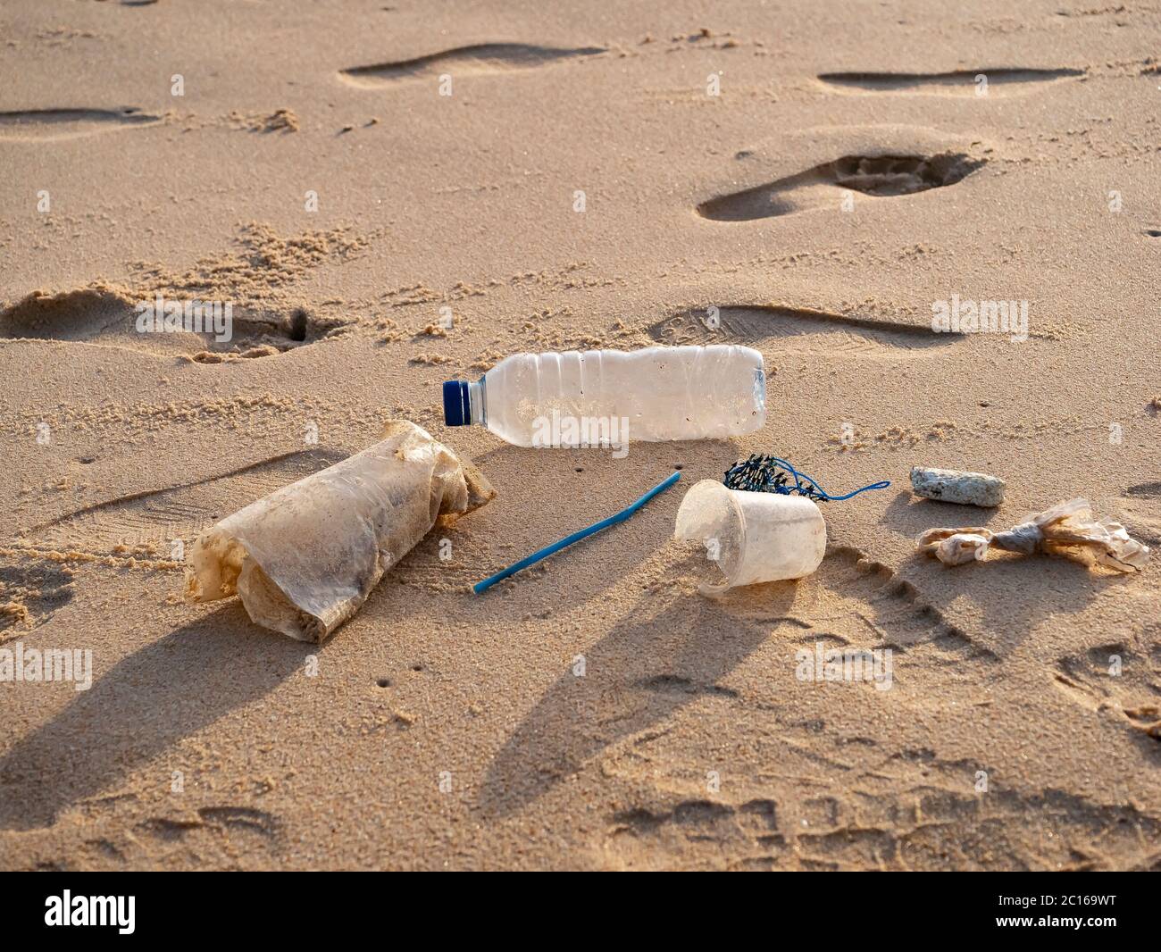 plastic garbage on sand sea beach Stock Photo - Alamy