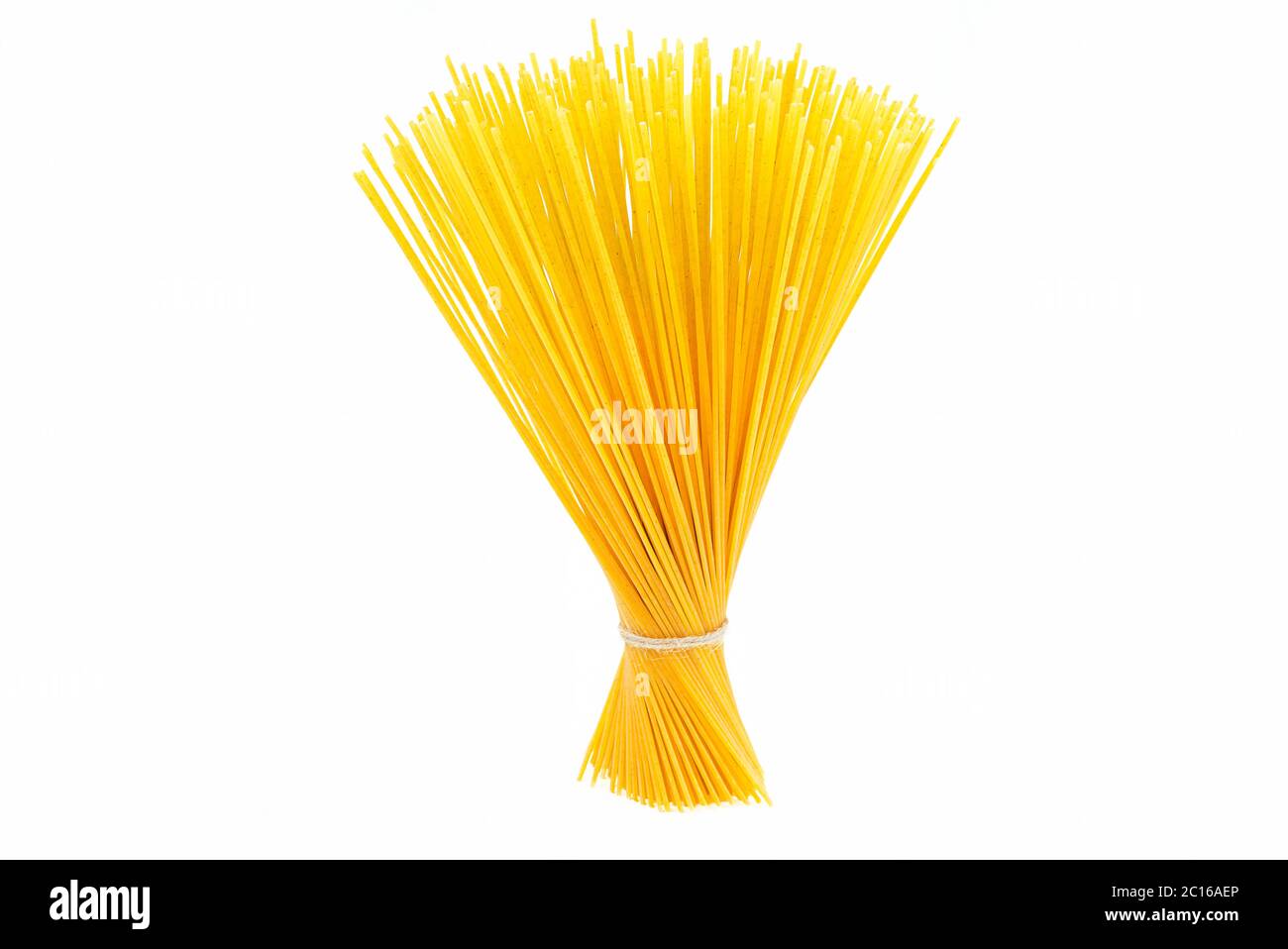 Pasta spagetti tied with a gray string standing in the middle, isolated ...