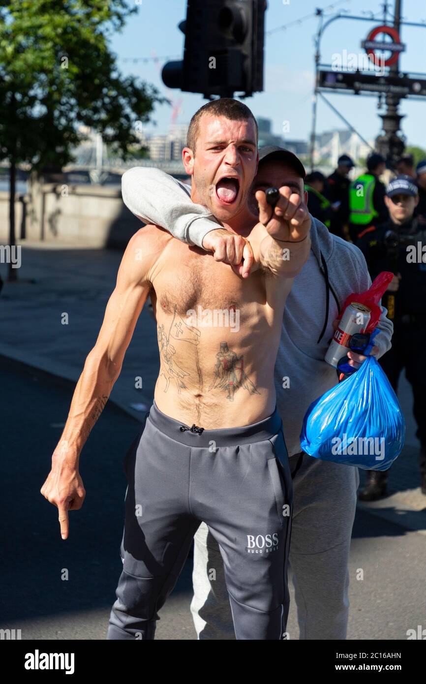 An angry far-right counter-protester at a demonstration in Parliament ...