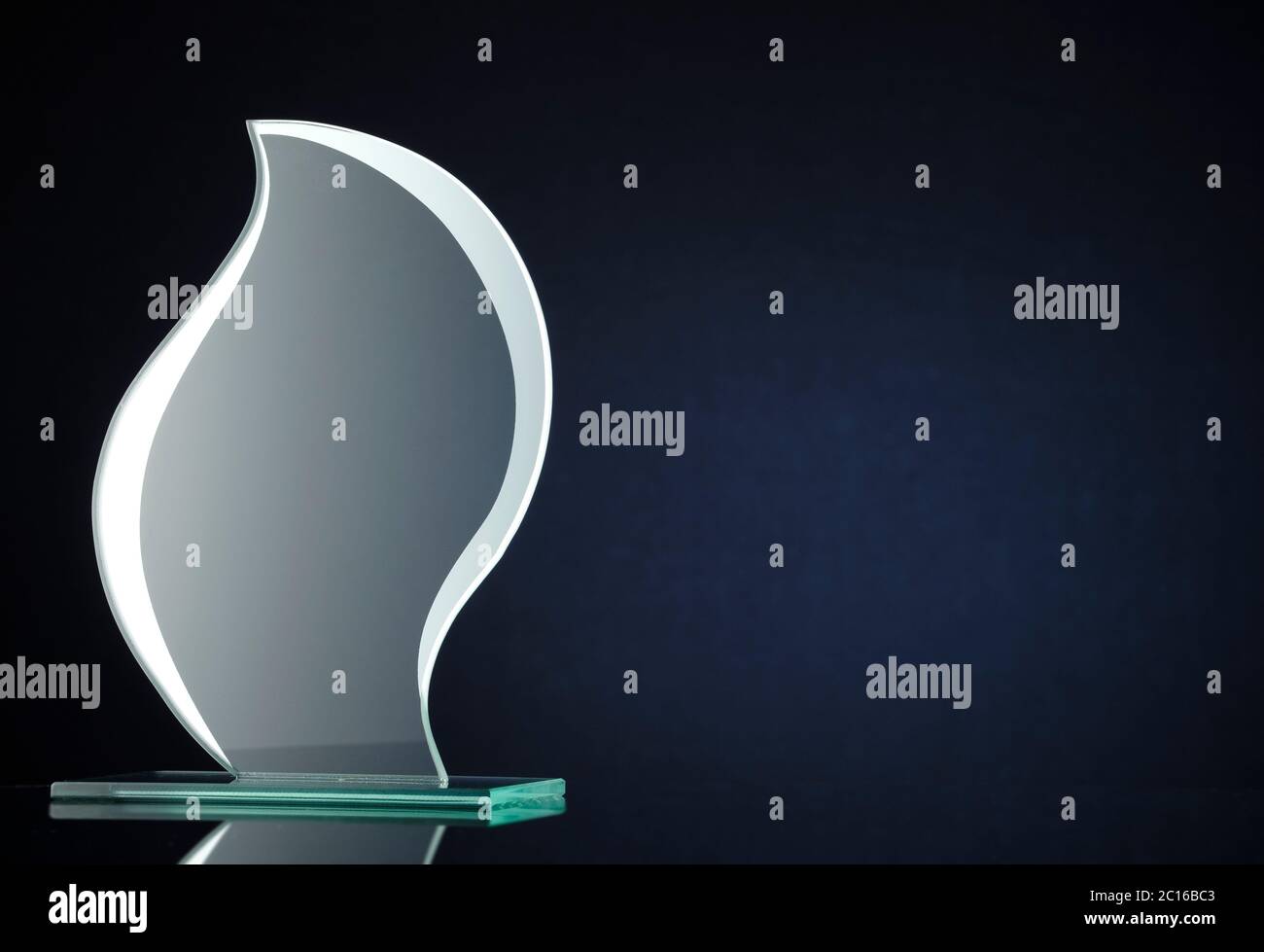 Stylish flame shaped glass trophy with copyspace for engraving the name ...