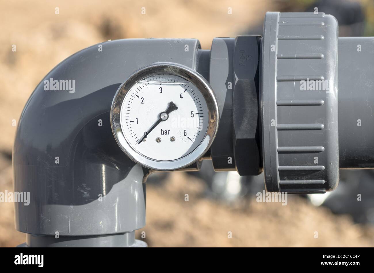 Close up of pressure gauge and pipes Stock Photo - Alamy