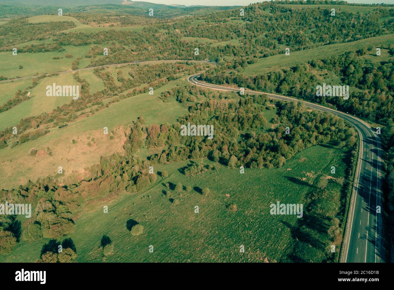 Aerial view of the mountain highway in spring. Beautiful skyview ...