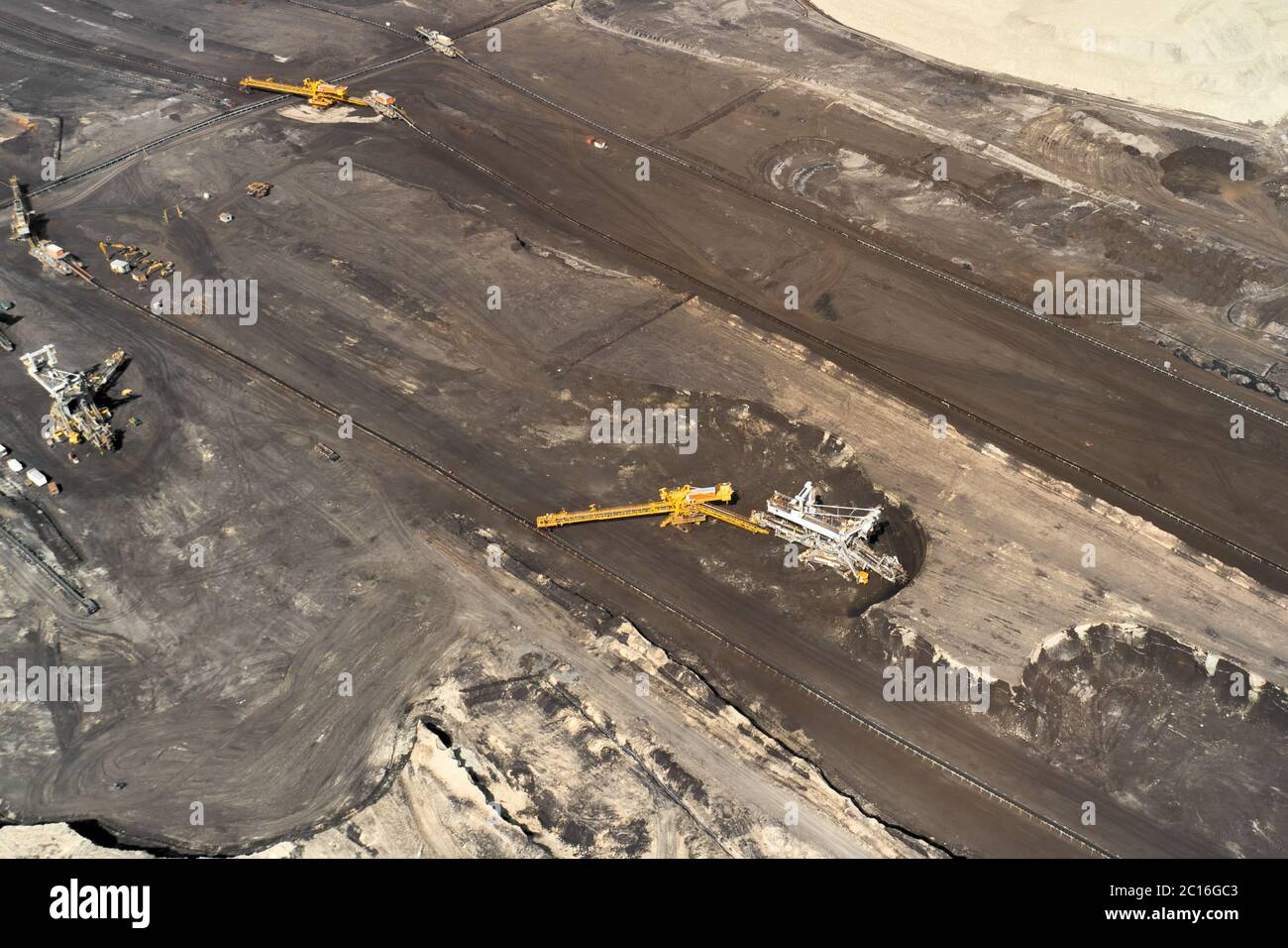 Aerial shoot of quarry with heavy bucket wheel excavators mining a coal ...