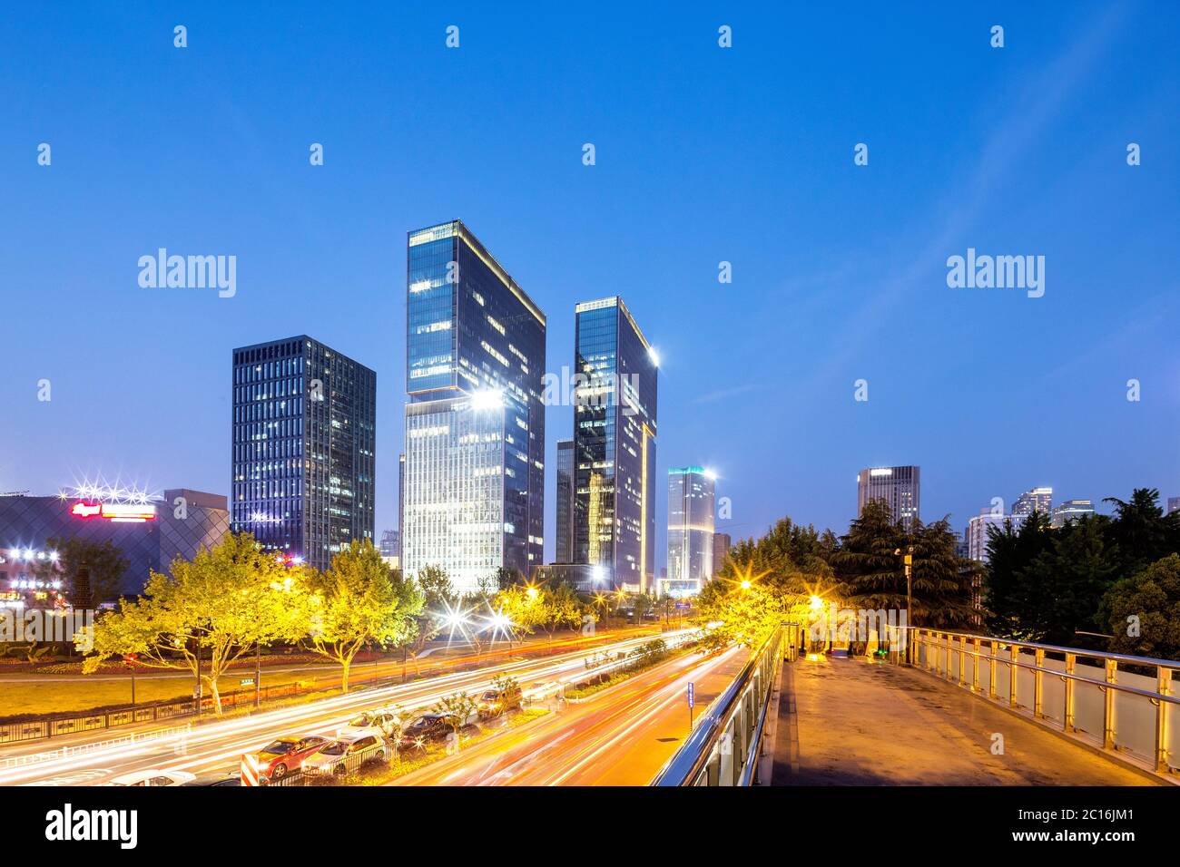 busy road with modern buildings Stock Photo - Alamy