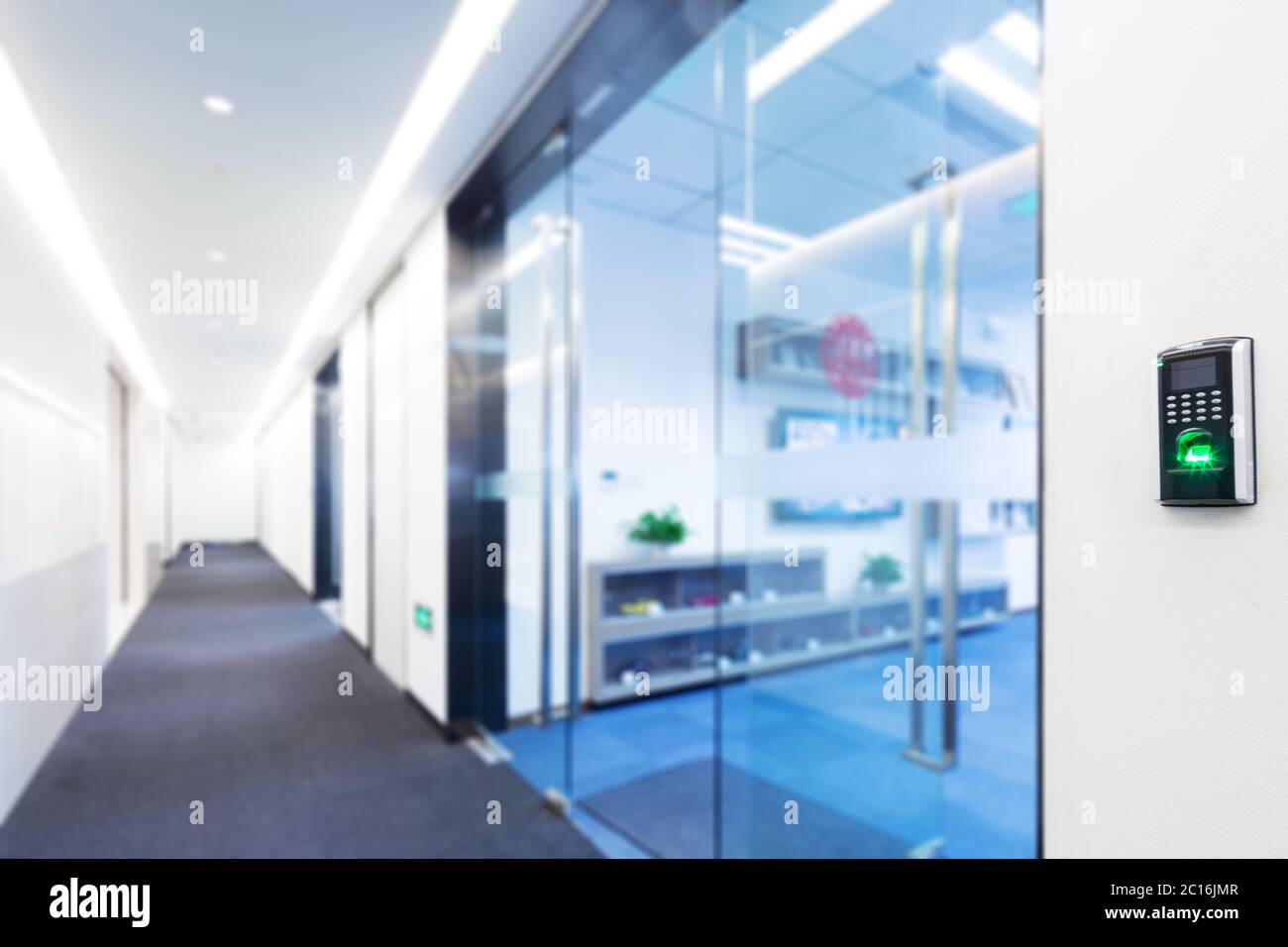 fingerprint scanner on wall in modern corridor Stock Photo - Alamy