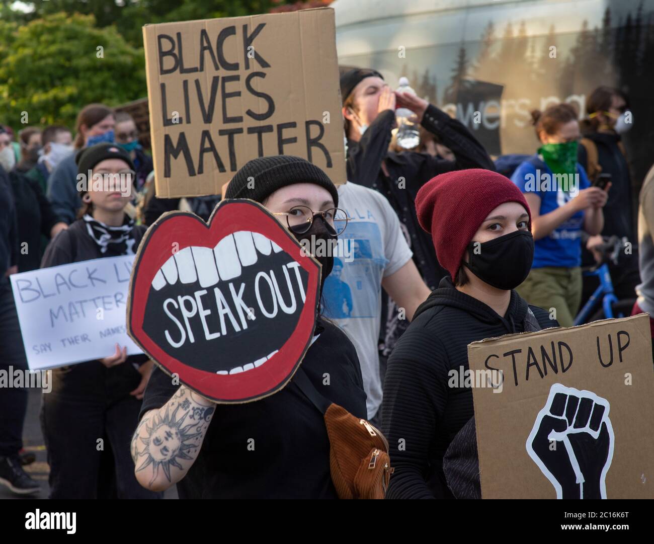 Protester with speak out sign Stock Photo - Alamy