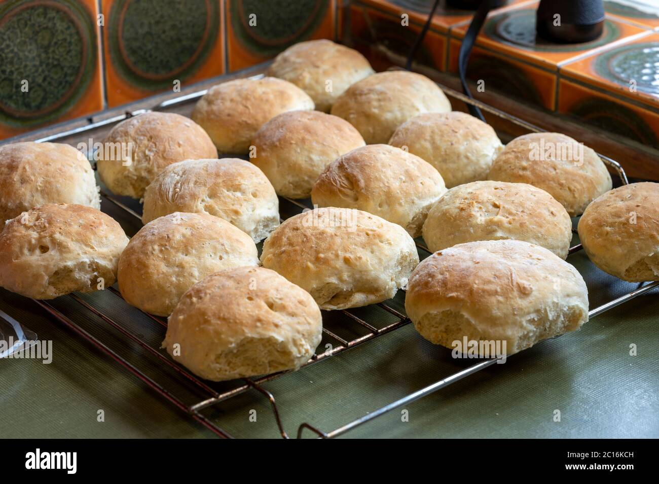 18 homemade buns on a grill Stock Photo - Alamy