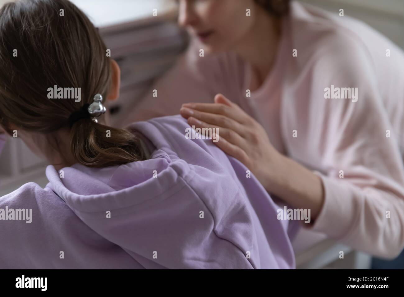Caring mom comfort sad teen daughter having problems Stock Photo - Alamy