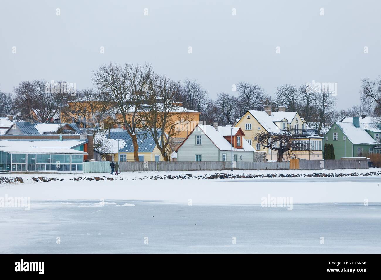 Iced city lake and waterfront of old town. Winter snowy season in ...