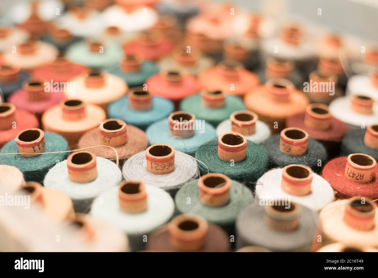 Variety of colorful sewing threads, birds eye Stock Photo - Alamy