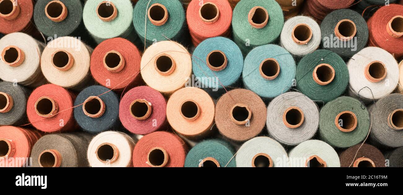 Variety of colorful sewing threads, birds eye Stock Photo - Alamy