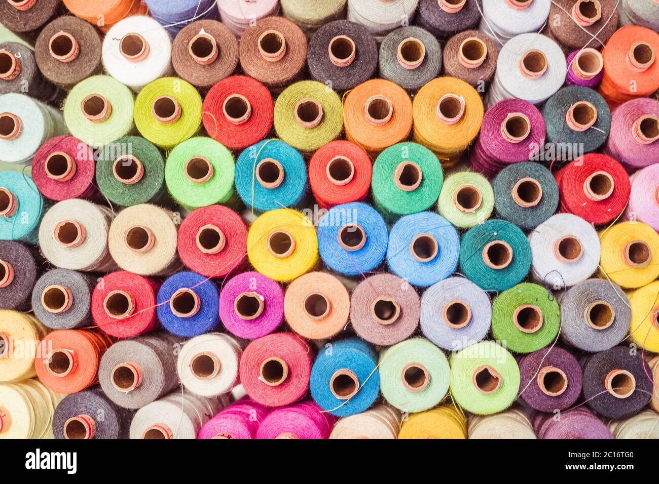 Variety of colorful sewing threads, birds eye Stock Photo - Alamy