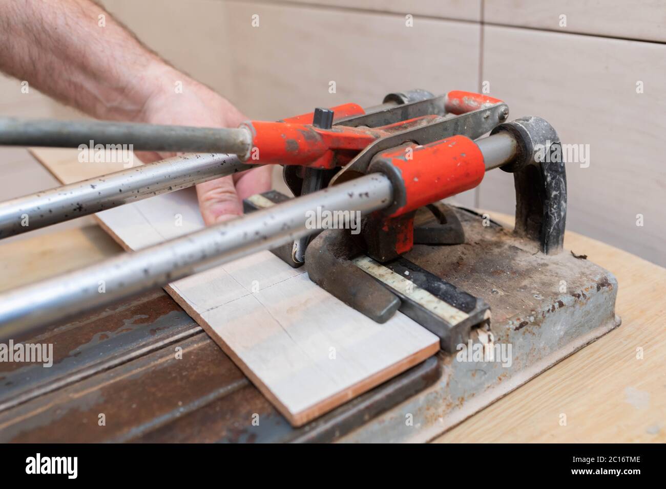 Tile cutting machine. Construction worker. Precise cutting of ceramic ...