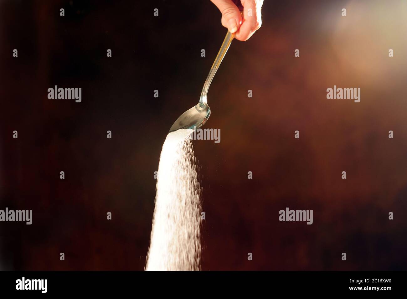 Grains white sugar pouring from hi-res stock photography and images - Alamy