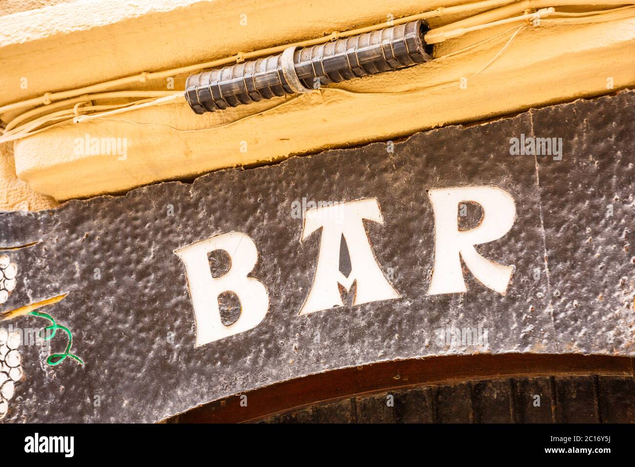 an old bar sign over a dirty wall Stock Photo - Alamy