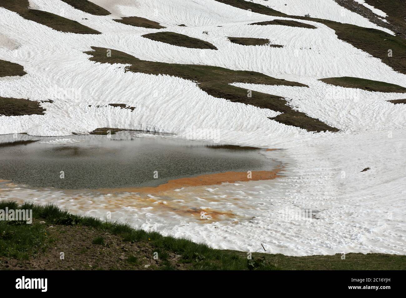 Lake frozen in the alps Stock Photo - Alamy