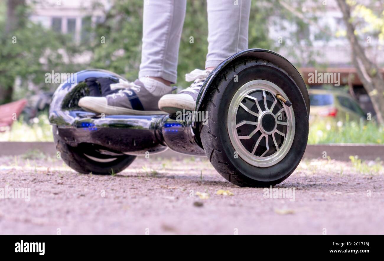 Girl feet on the hover board Stock Photo - Alamy