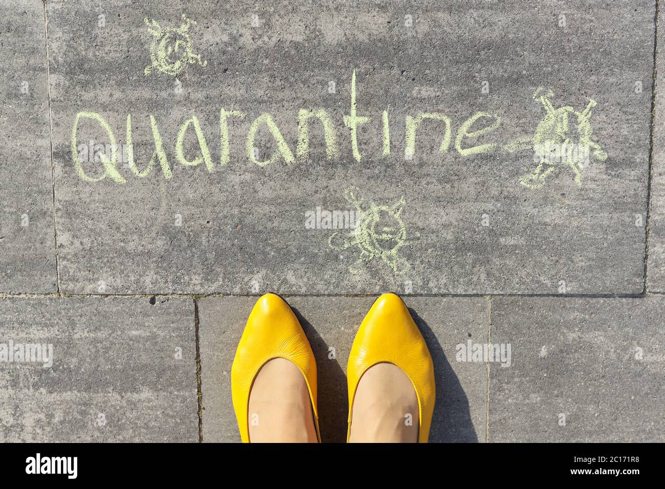 Quarantine concept, top view on woman legs and text written in chalk on ...