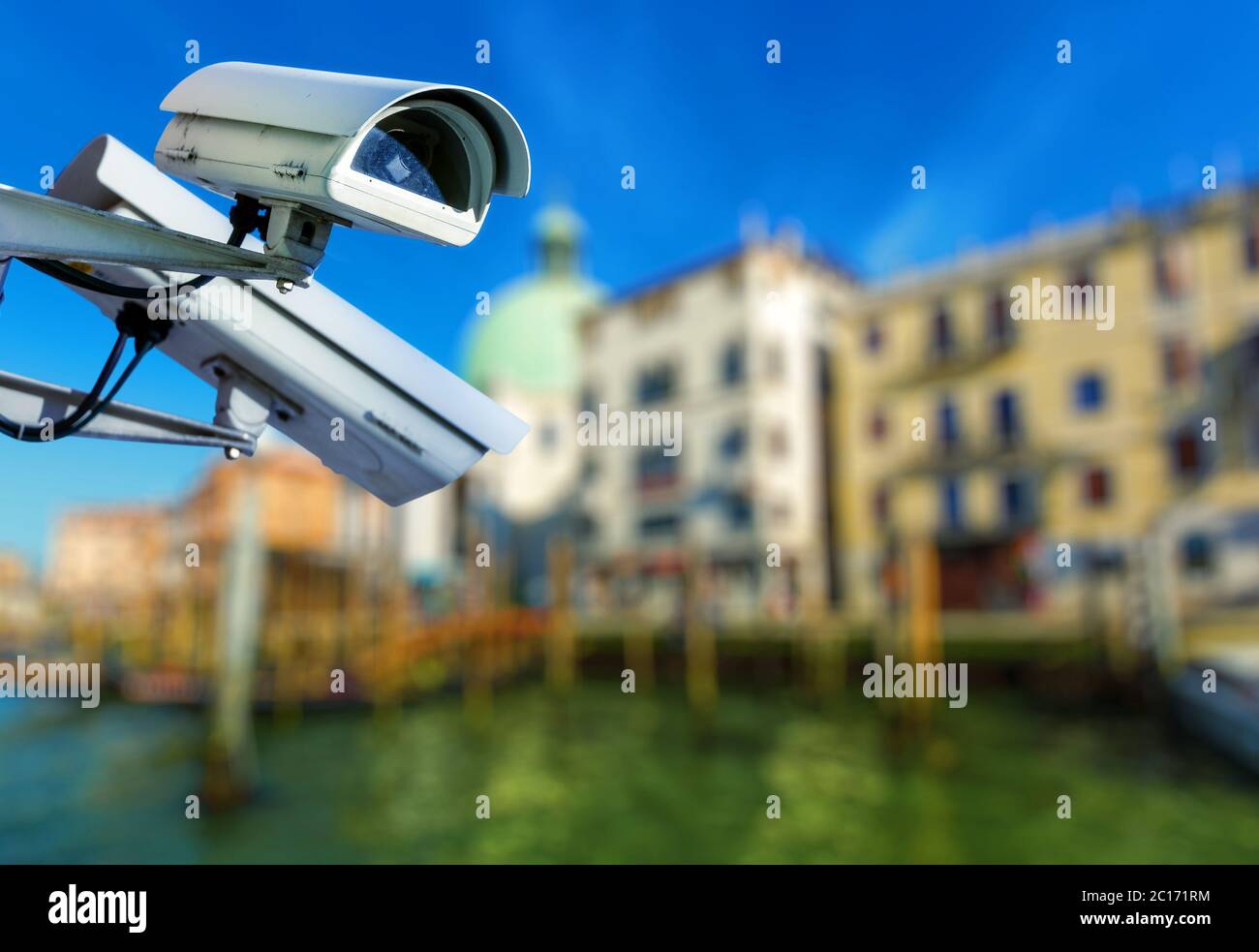security CCTV camera with canal grande of venice on blurry background ...