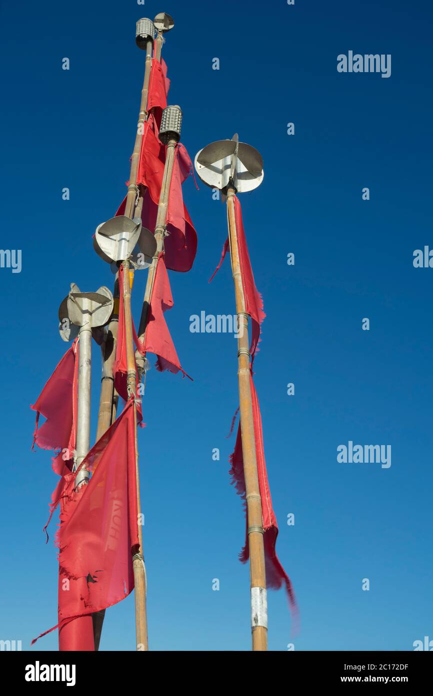 red flags of a fishermen Stock Photo - Alamy