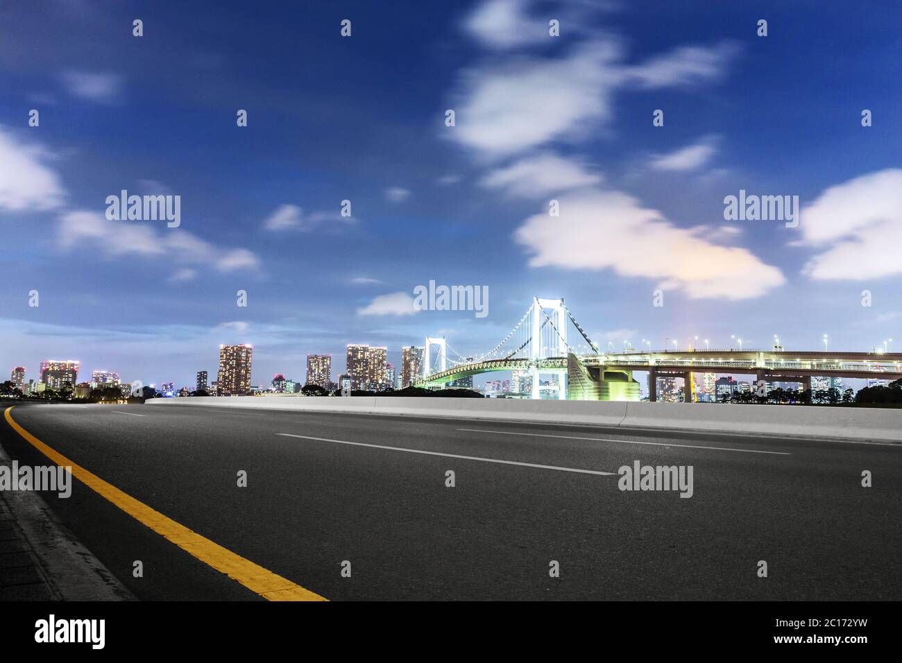 empty road with suspension bridge in modern city Stock Photo - Alamy