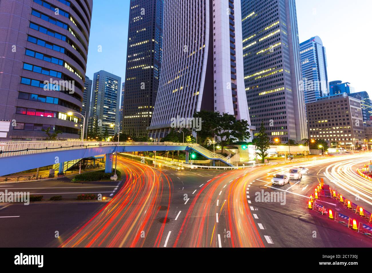 busy traffic on road in midtown of modern city Stock Photo - Alamy