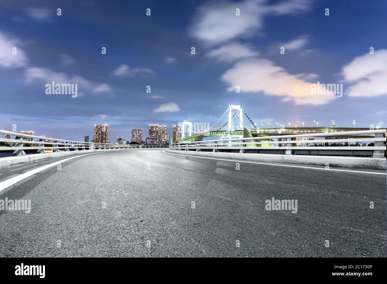 empty road with suspension bridge in modern city Stock Photo - Alamy