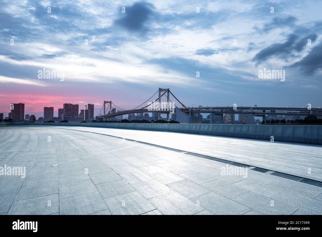 empty pedestrians sidewalk with modern suspension bridge Stock Photo ...