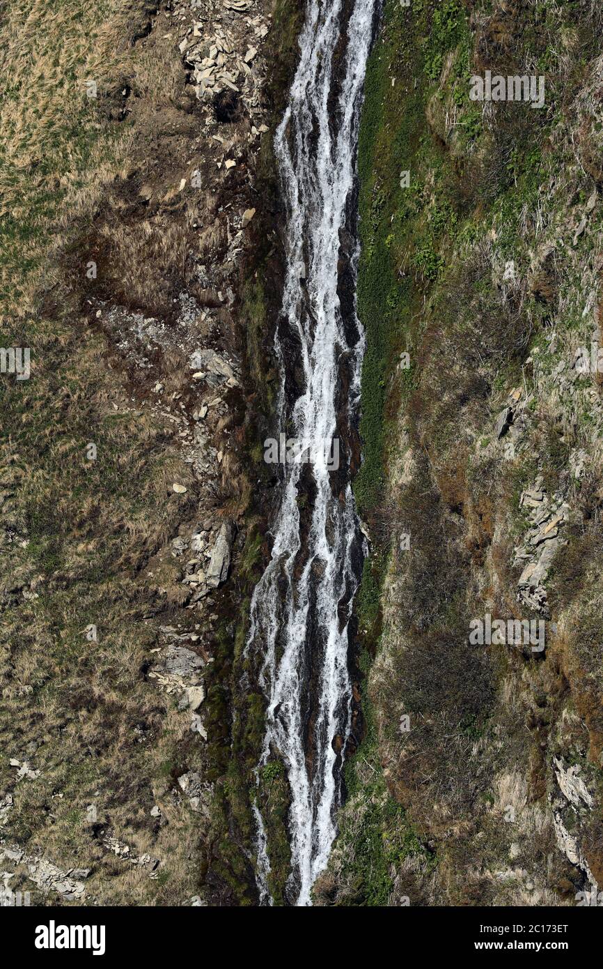 Cascade waterfall in the Alps Stock Photo - Alamy